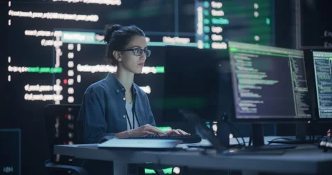 Female Programmer Writing Code Surrounde... | Stock Video | Pond5