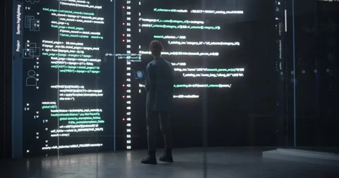 Female Programmer Writing Code Surrounde... | Stock Video | Pond5