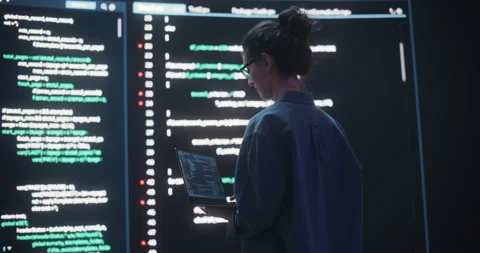 Female Programmer Writing Code Surrounde... | Stock Video | Pond5