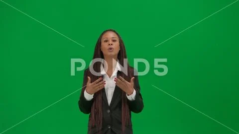 Female reporter isolated on chroma key green screen background. African ...