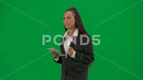 Female reporter isolated on chroma key green screen background. African ...