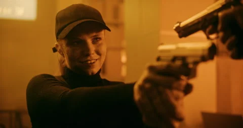 Female Secret Agent Pointing the Gun at ... | Stock Video | Pond5