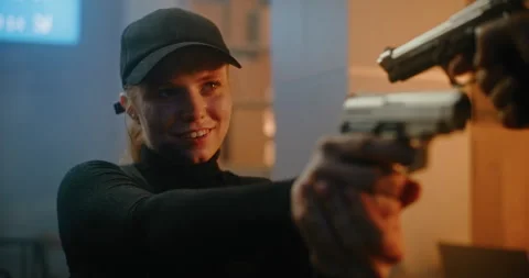 Female Secret Agent Pointing the Gun at ... | Stock Video | Pond5
