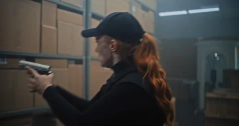 Female Secret Agent in Tactical Gear Hid... | Stock Video | Pond5