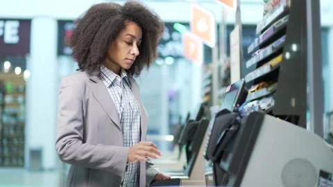 Female shopper using a self-service cash... | Stock Video | Pond5