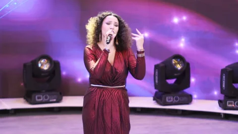 Female Singer in Red Performs Best Hit o... | Stock Video | Pond5