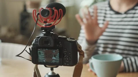 Female sitting in front of camera and re... | Stock Video | Pond5