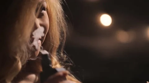 Female smoke vaper, inhale and exhale va... | Stock Video | Pond5