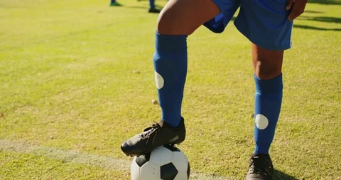 Female soccer player standing with one f... | Stock Video | Pond5