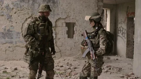 A female soldier gives a high five to he... | Stock Video | Pond5
