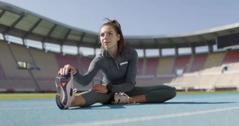 Female sports runner girl stretching and... | Stock Video | Pond5
