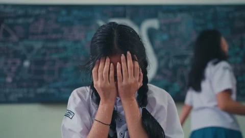 a female student cries in class after be... | Stock Video | Pond5