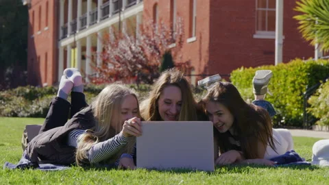 Female students using wireless connectio... | Stock Video | Pond5