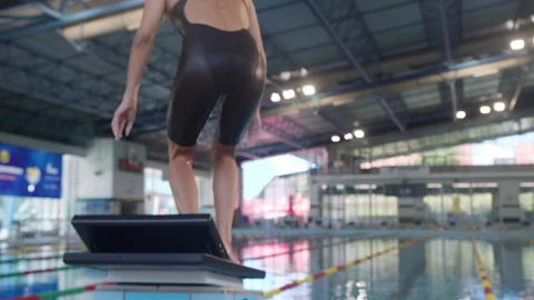 Female swimmer approaching a diving boar... | Stock Video | Pond5