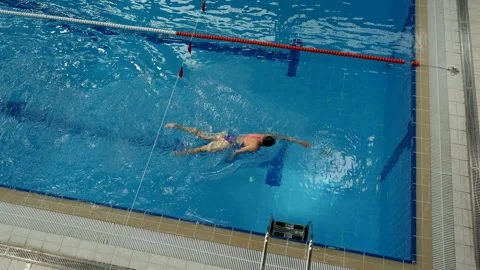 Female swimmer doing backstroke and flip... | Stock Video | Pond5
