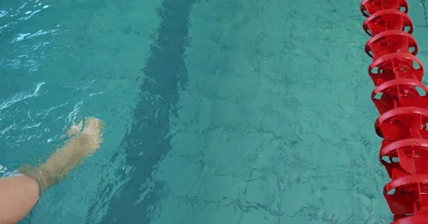 Female swimmer going into swimming pool | Stock Video | Pond5