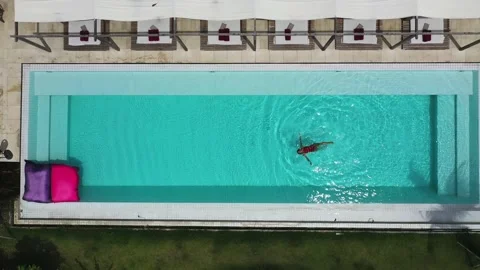 Female swimming face up at Shore Amora C... | Stock Video | Pond5