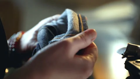 A female tailor hemming old jeans with v... | Stock Video | Pond5