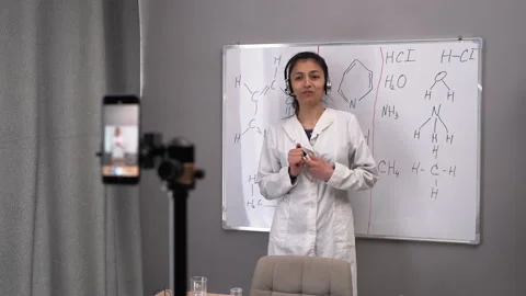 a female teacher-blogger is standing at ... | Stock Video | Pond5