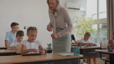 Female teacher controlling learning proc... | Stock Video | Pond5