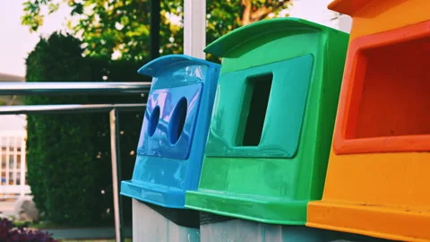 Female throw plastic bottle into recycle... | Stock Video | Pond5