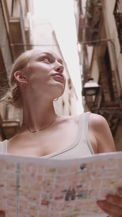 Female tourist maps user walking in old ... | Stock Video | Pond5