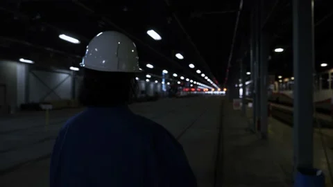 Female transit worker walking in dark ma... | Stock Video | Pond5