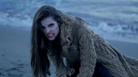Female vampire screaming after killing m... | Stock Video | Pond5