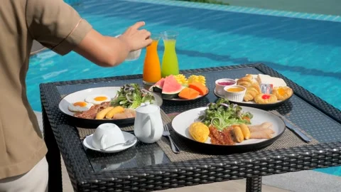 Female waiter hand serving breakfast foo... | Stock Video | Pond5