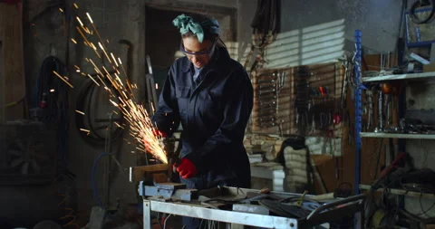 Female Welder Using Angle Grinder to Pol... | Stock Video | Pond5