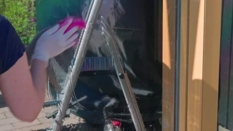 Female wiping water drops with rag after... | Stock Video | Pond5