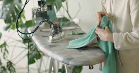 Female worker of clothes factory ironing... | Stock Video | Pond5