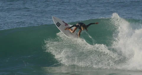 Female young woman Surfer surfing waves ... | Stock Video | Pond5