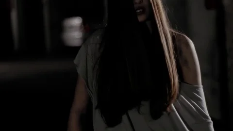 Female zombie chasing man walking in gar... | Stock Video | Pond5