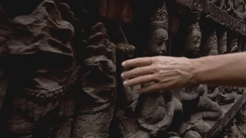 Female's hand touching ancient statue in... | Stock Video | Pond5