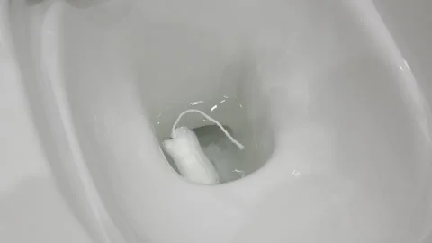 feminine hygiene tampon in toilet bowl a... | Stock Video | Pond5
