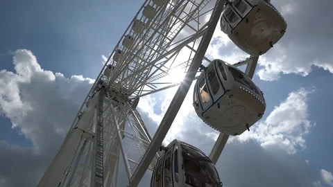 Ferris Wheel Rotating Sun Clouds | Stock Video | Pond5