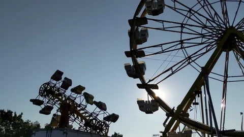 Ferris wheel spinning in an amusement pa... | Stock Video | Pond5