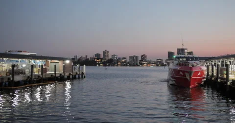 Ferry mooring at Elizabeth Quay at sunse... | Stock Video | Pond5