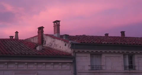 Fiery pink sunset over building chimneys... | Stock Video | Pond5