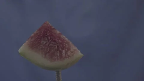 Fig rotating with loop on blue screen fo... | Stock Video | Pond5