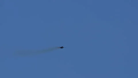 Fighter Jet Flying in the Distance Again... | Stock Video | Pond5