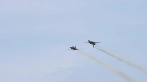 Fighter jet in inverted flight over anot... | Stock Video | Pond5