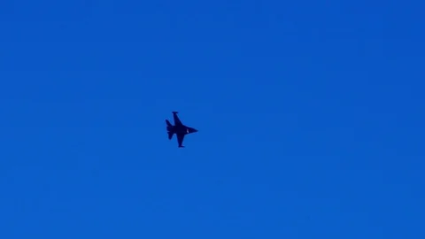 A Fighter Jet is making a turn on air. | Stock Video | Pond5