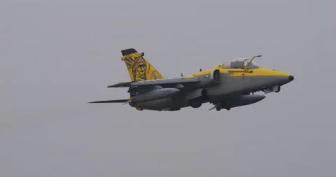 Fighter jet plane with yellow gray fusel... | Stock Video | Pond5
