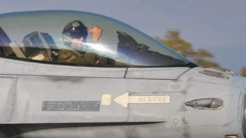 Fighter pilot with helmet salute from th... | Stock Video | Pond5