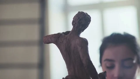 Figure of an ancient man from clay in fr... | Stock Video | Pond5