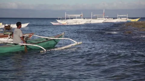 filipino fisherman in fragile boat, cult... | Stock Video | Pond5