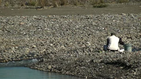 Filipino man hand washing clothes at a r... | Stock Video | Pond5