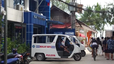 Filipino police inside E-trike vehicles | Stock Video | Pond5